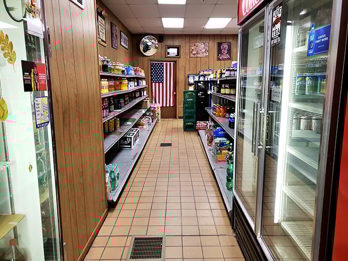 The classic corner store interior &ndash; wood paneling, American flag, and narrow aisles filled with snacks. This isn't Instagram-bait; it's the real deal.