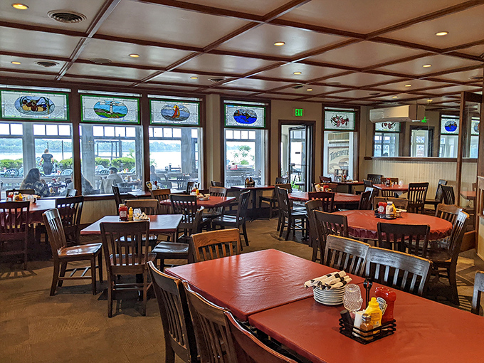 Wooden tables, stained glass windows, and water views create the perfect backdrop for memorable meals. No designer needed&mdash;just honest charm and spectacular scenery.