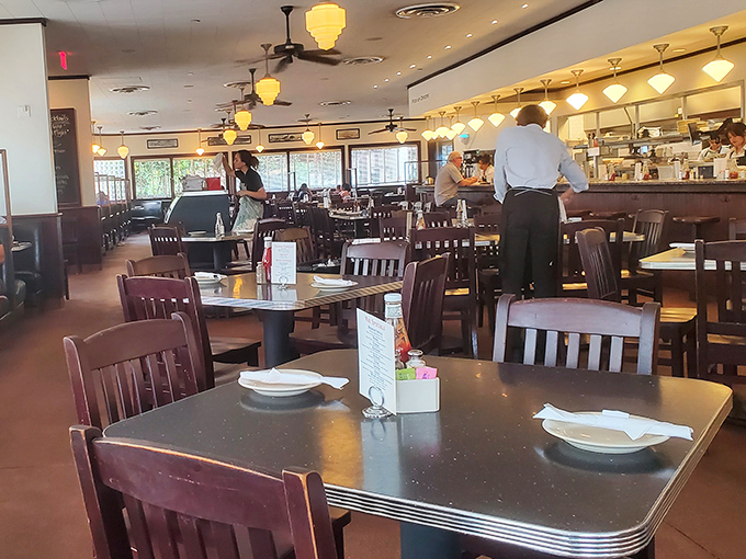 Step inside where checkered floors and vintage charm create the perfect backdrop for serious eating.