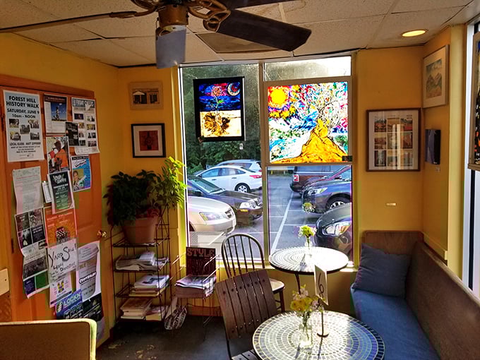 Cozy mismatched furniture and mosaic tables create the perfect neighborhood coffee shop atmosphere.