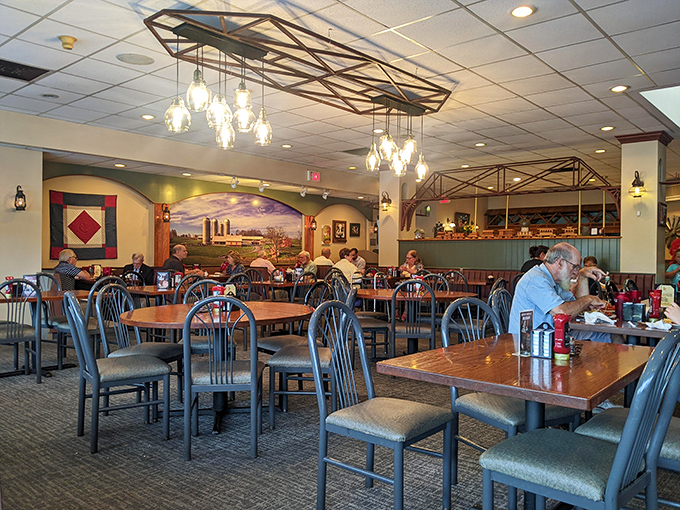 Rustic wooden tables beneath warm lighting create that "grandma's dining room" feeling—minus the awkward questions about when you're getting married.