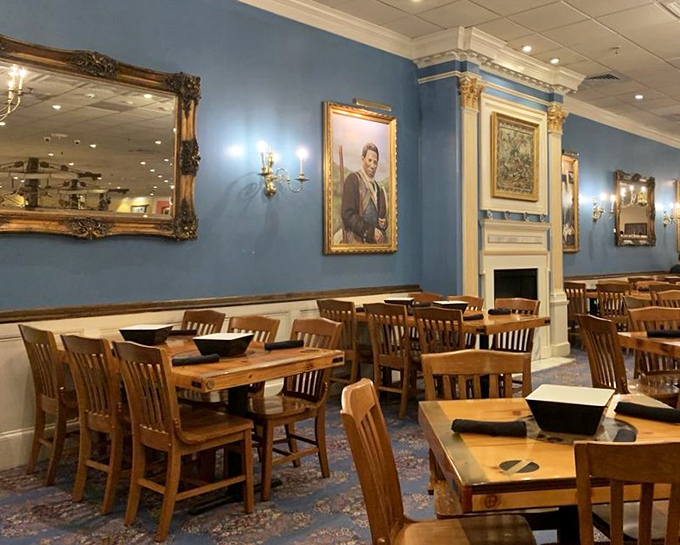 Blue walls, wooden tables, and maritime elegance create an atmosphere that says, "This isn't just dinner&mdash;it's a seafood soir&eacute;e with historical flair."
