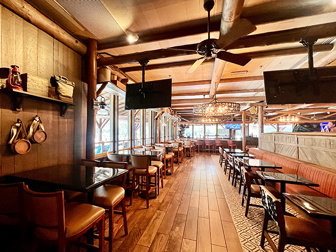 Exposed beams and wagon wheels create an atmosphere where every meal feels like a frontier celebration.