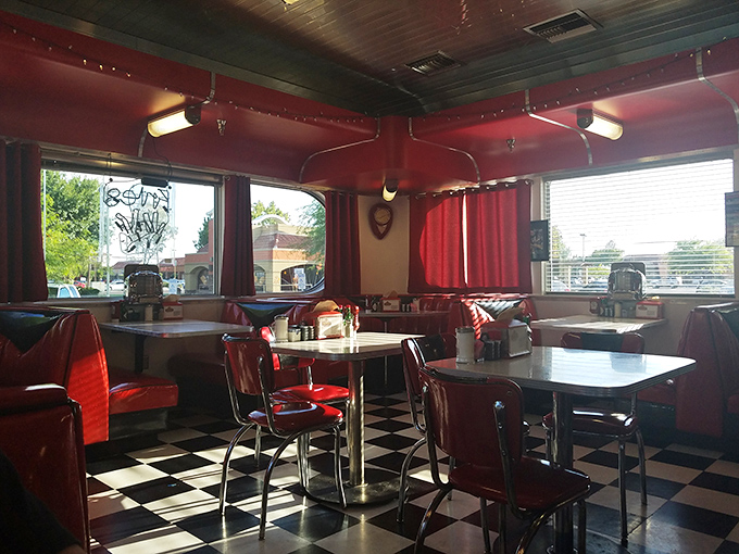 Red vinyl booths and checkered floors create the perfect backdrop for serious milkshake contemplation sessions.