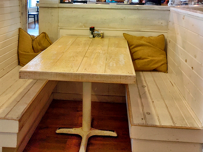 Cozy nooks with rustic wooden tables and mustard-yellow cushions invite you to settle in for a breakfast worth savoring.