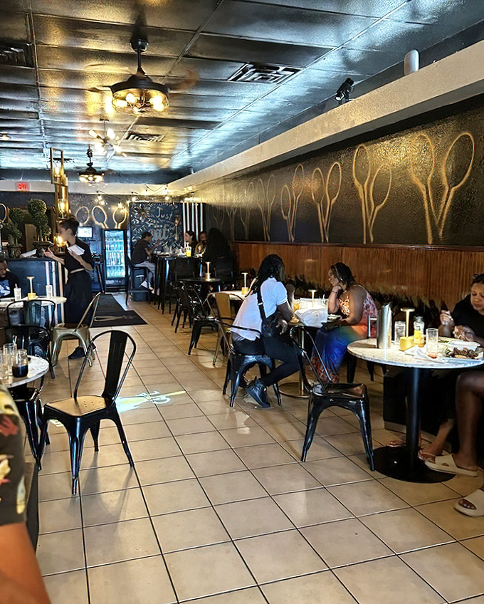 The spoon-adorned wall isn't just clever d&eacute;cor&mdash;it's a visual manifesto announcing that this place takes its comfort food seriously.