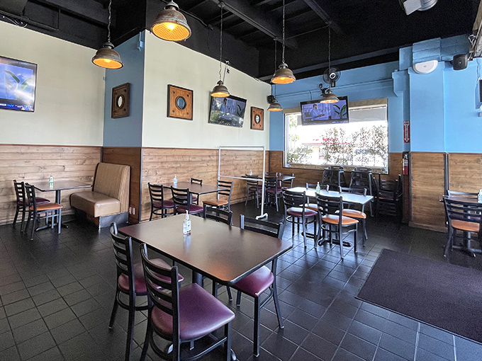 Blue walls meet wooden wainscoting in this cozy dining room where comfort trumps pretension and flavor reigns supreme.
