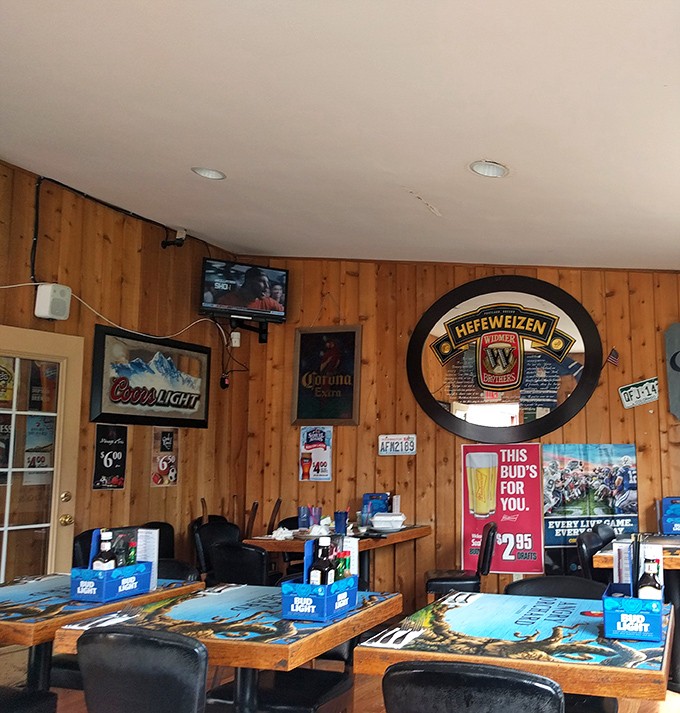 The wood-paneled walls and beer memorabilia create that perfect "everybody knows your name" vibe that makes regulars out of first-timers.