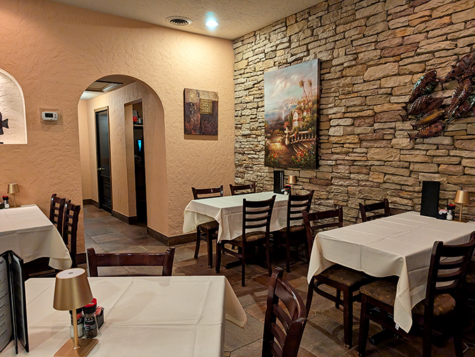 Stone walls and white tablecloths create that perfect middle ground between "fancy enough for an anniversary" and "comfortable enough to unbutton after the entr&eacute;e."