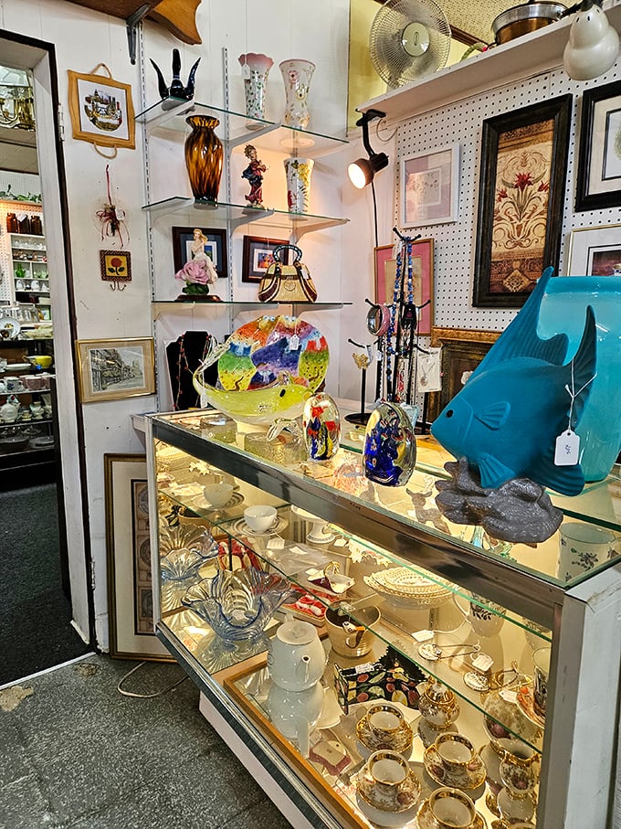 This glass display case is where your wallet comes to surrender. Colorful art glass and delicate teacups wait patiently for their forever homes.