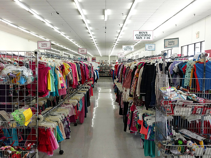 A rainbow explosion of children's clothing awaits young fashionistas. Those tiny hangers hold everything from barely-worn party dresses to play clothes ready for new adventures.
