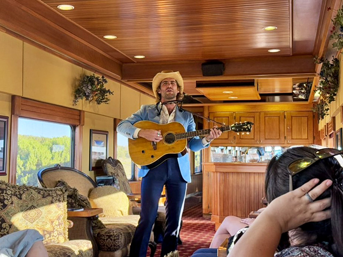 Cowboy troubadours serenade passengers with Western ballads, turning train cars into rolling concert halls where every seat has the best view.