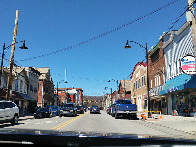 Blue skies frame Zelienople's historic downtown, where locally-owned businesses still outnumber chain stores&mdash;a Main Street that actually matters.