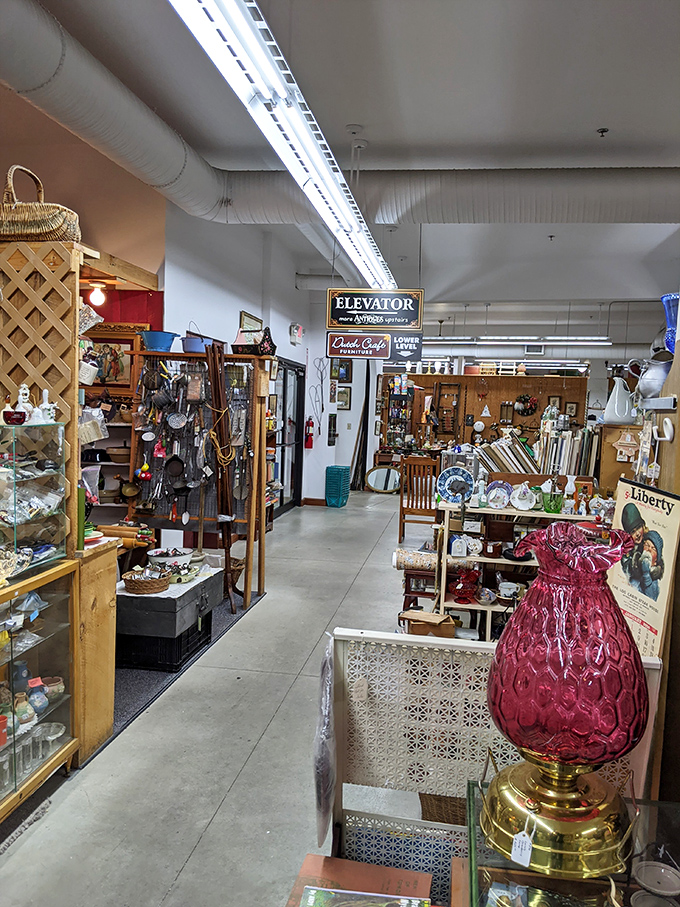 Step inside and the hunt begins! This aisle showcases everything from vintage lamps to collectible glassware, with that gorgeous cranberry lamp stealing the spotlight.