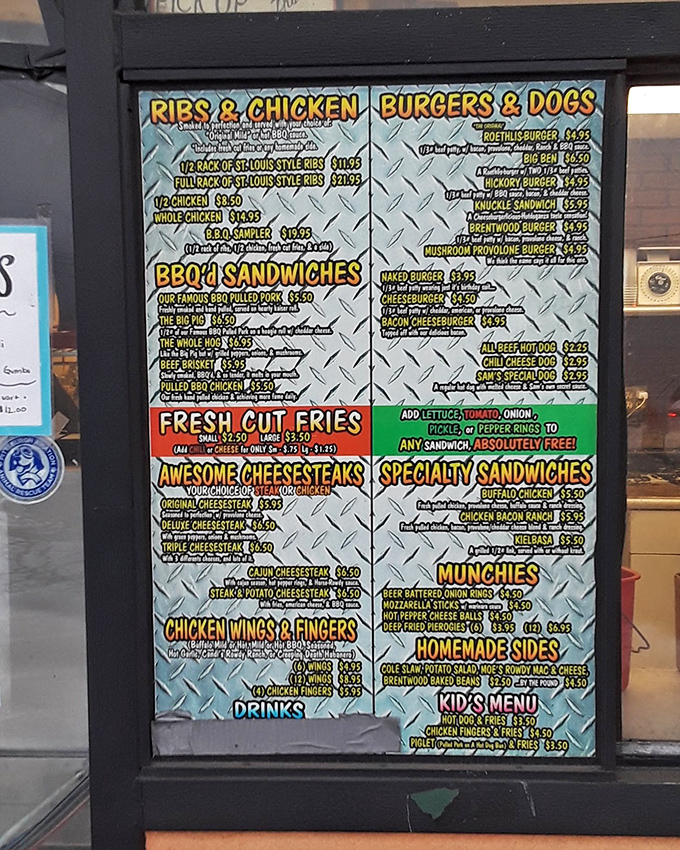 A menu that doesn't mince words&mdash;just promises meat magic. The diamond-plate background is your first clue: this place means serious business.