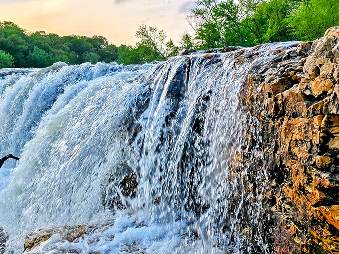 Up close with the cascade's raw power. The water doesn't just fall&mdash;it performs, creating a natural symphony you can hear from hundreds of yards away.