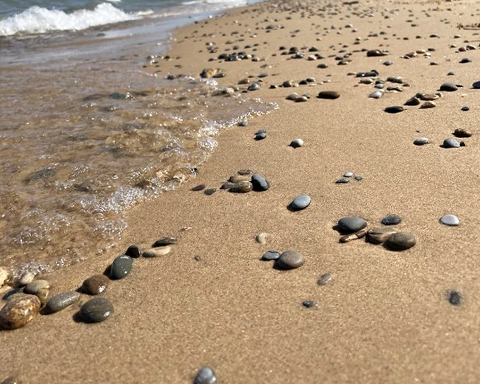 Nature's mosaic: Smooth stones dot the shoreline like an artist's installation, each one waiting to be discovered by beachcombers young and old.