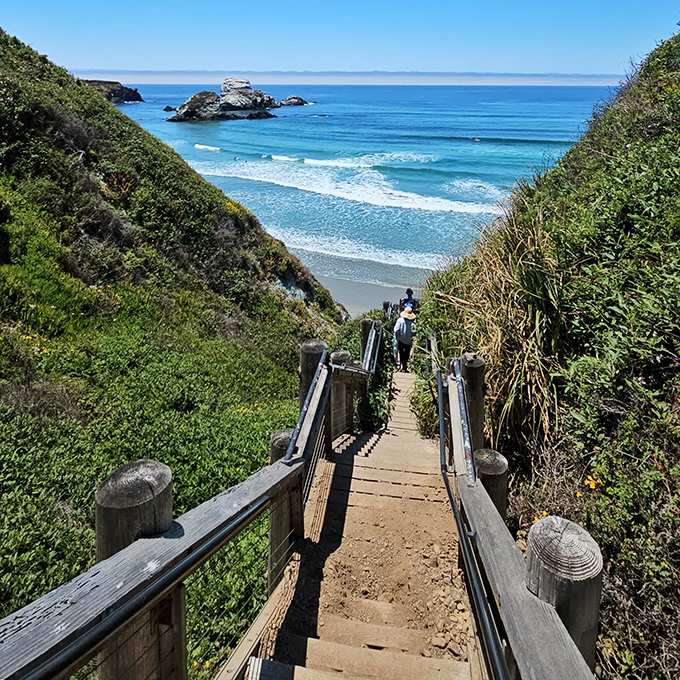 Nature's grand staircase beckons visitors downward, each step revealing more of the Pacific's endless blue canvas and sculptural offshore rocks.