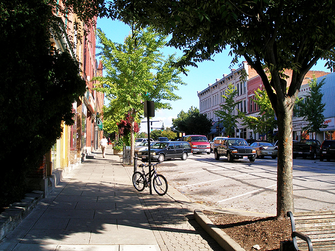 Main Street's brick-lined sidewalks invite leisurely strolls past storefronts where bicycles outnumber parking meters. Small town America with an intellectual twist.