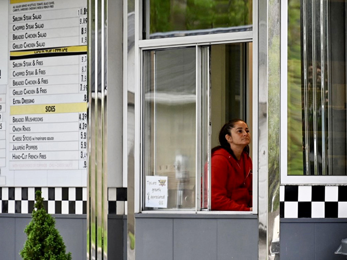 At Jerry's service window, the age-old ritual unfolds: flash your lights, place your order, and prepare for a tray of Pennsylvania comfort to appear like culinary magic.