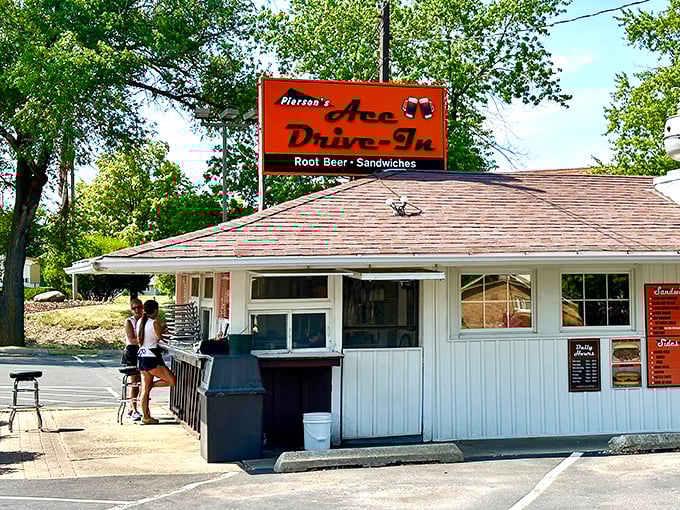 Where memories are made: Customers line up at Ace Drive-In's walk-up window, participating in a ritual that's remained unchanged for decades.