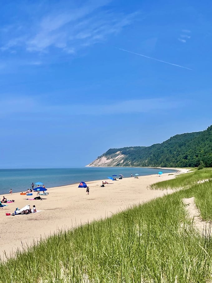 Mother Nature showing off again! Those towering bluffs stand guard over pristine shores where the only traffic jam involves sandpipers racing the waves.