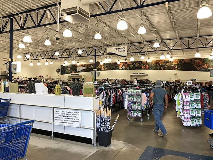 Warehouse-style shopping paradise where yesterday's donations become today's perfect finds under gleaming industrial lights.