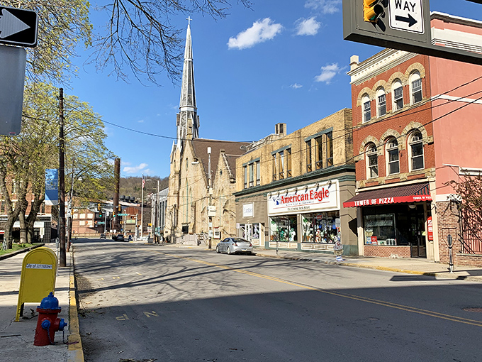 Johnstown's church spires reach skyward among storefronts, where small-town commerce meets spiritual aspirations.