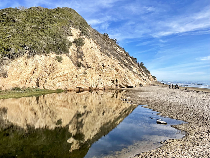 Nature's mirror: coastal cliffs reflect perfectly in this tidal pool. Even geology shows off in Santa Barbara!