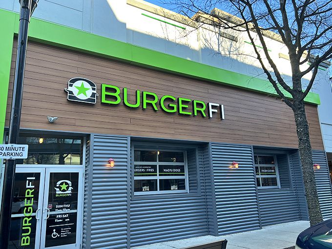 BurgerFi's modern storefront glows with eco-friendly promise. That bright green sign is basically a burger bat-signal for your appetite.