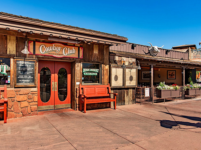 The Cowboy Club's rustic wooden facade and red doors transport you to the Old West before you've even tasted a bite.