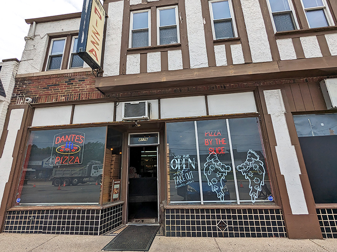 Dante's Pizza: The Tudor-style storefront of Dante's Pizza promises a slice of heaven with its vintage neon glow.
