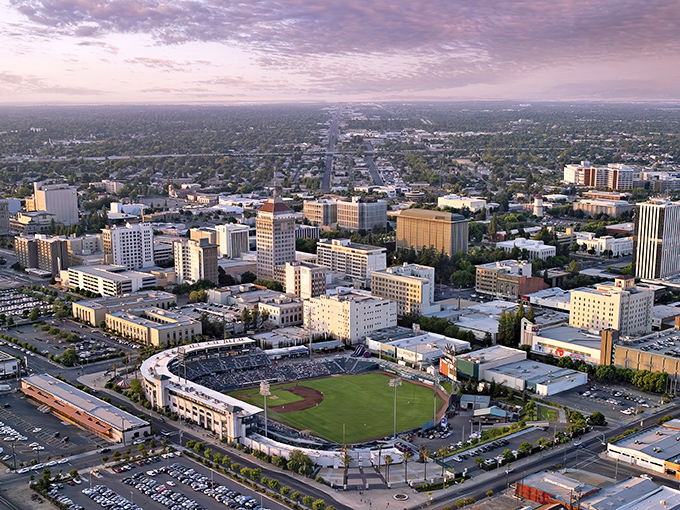 Fresno's downtown skyline shimmers under the evening sky, proving affordable California living doesn't mean sacrificing city conveniences.