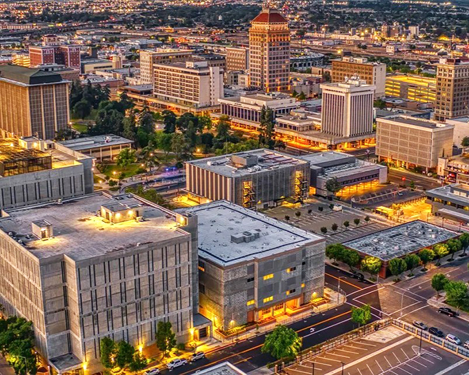 Fresno's cityscape unfolds beneath the majestic Sierra Nevada mountains – where affordable living meets million-dollar views.