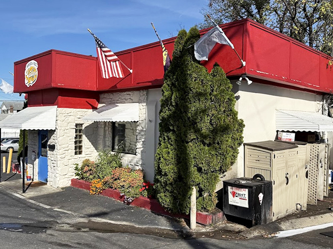 Gabby's stone fortress of flavor stands proud with its American flag &ndash; a patriotic salute to burger perfection.