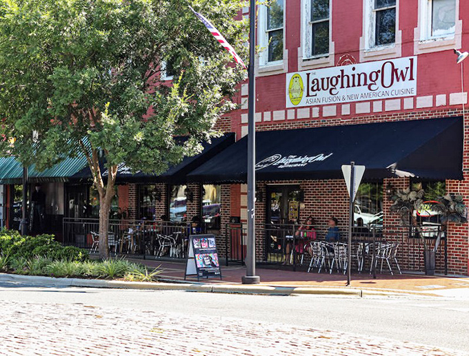 The Laughing Owl's bright red facade promises good times ahead. Nothing says "eat here" quite like a building that cheerful.