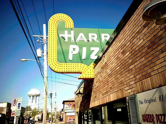 That vintage yellow sign has been guiding hungry Quad Cities folks to pizza nirvana since before disco was cool.