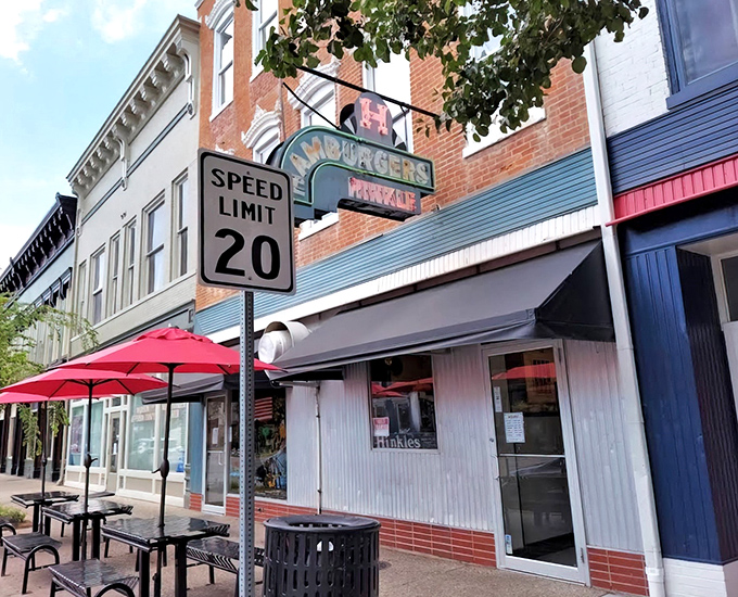 Hinkle's neon sign glows with the promise of hamburger heaven in historic Madison, a beacon of comfort food that time forgot.