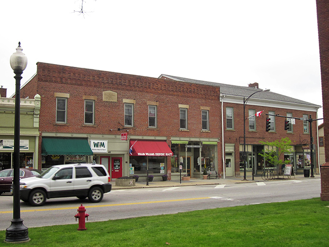 That green awning calls out like a friendly neighbor waving you over for lemonade on the porch.