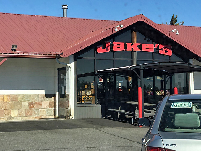 Jake's Diner's distinctive red roof signals comfort food ahead, like a lighthouse for hungry travelers.