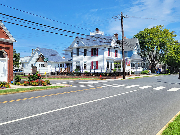 Classic white homes with red shutters line Lewes' historic streets &ndash; a postcard-perfect scene that whispers stories from Delaware's colonial past.