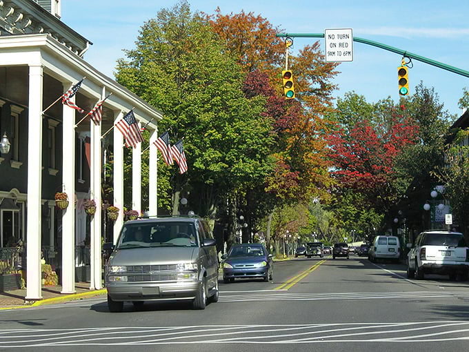 Lewisburg's tree-lined streets burst with autumn colors, framing historic buildings that have witnessed centuries of American life.