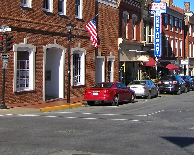 Lexington's classic brick storefronts proudly display the American flag, welcoming visitors to this historic Virginia gem.