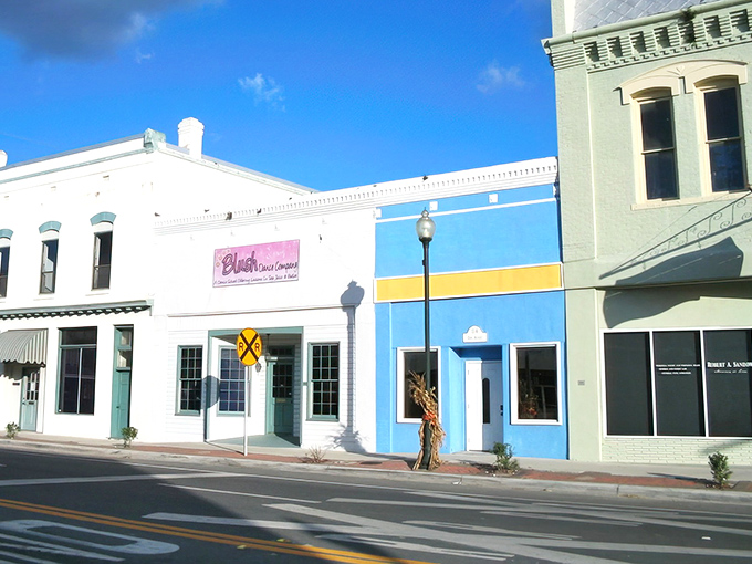 Splash of color in Live Oak! These storefronts have more character than a Wes Anderson film—railroad crossing included!