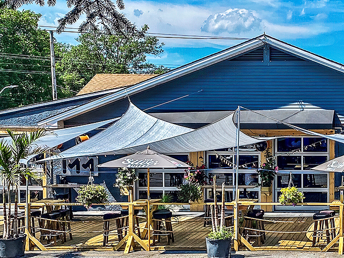 Outdoor dining with shade sails creates the perfect spot for savoring gourmet comfort food. 