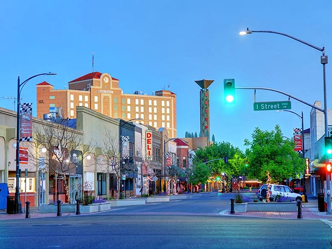 Modesto after dark has a certain magic&mdash;storefronts beckon with local treasures while that grand building watches over the evening bustle.