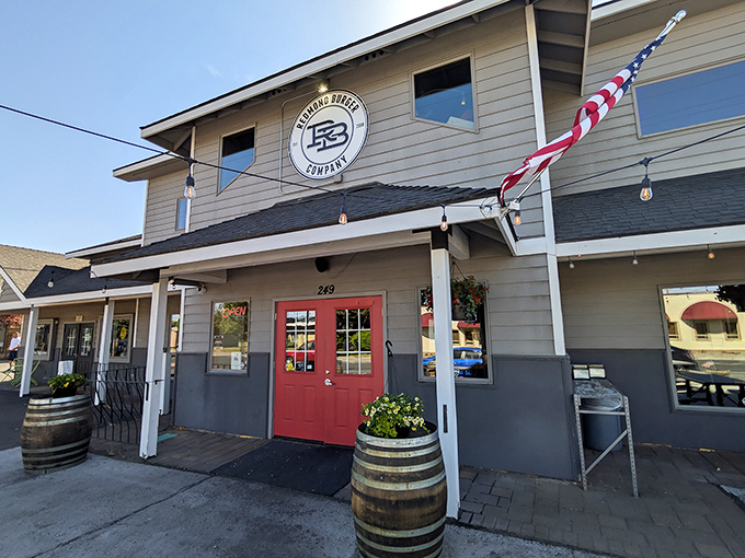 Redmond Burger Company's charming facade with wine barrels and American flag screams "come hungry, leave happy."