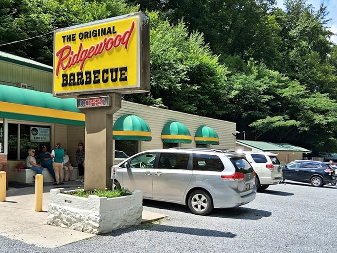 "Those green awnings are like beacons to BBQ pilgrims. The full parking lot tells you everything you need to know."