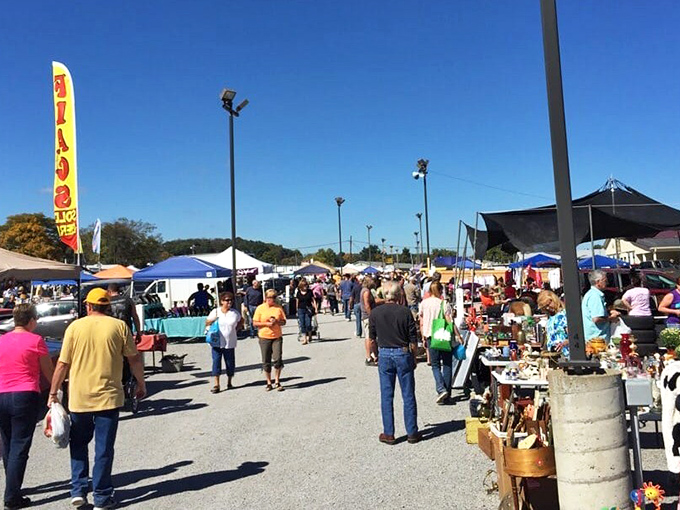 Rogers Flea Market in full swing! The crowds navigate this bargain labyrinth where everything from antiques to zucchini awaits discovery.