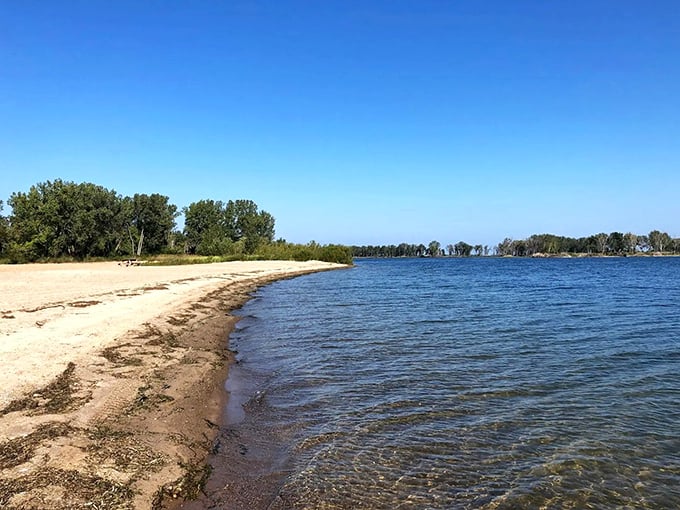 Sayers Dam's curved shoreline stretches like nature's smile, inviting beachgoers to dip their toes in its refreshing embrace.